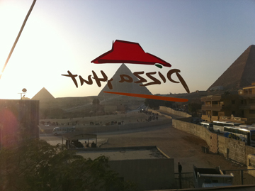 View of pyramids at Giza from inside Pizza Hut, January 28, 2011. Photo ...